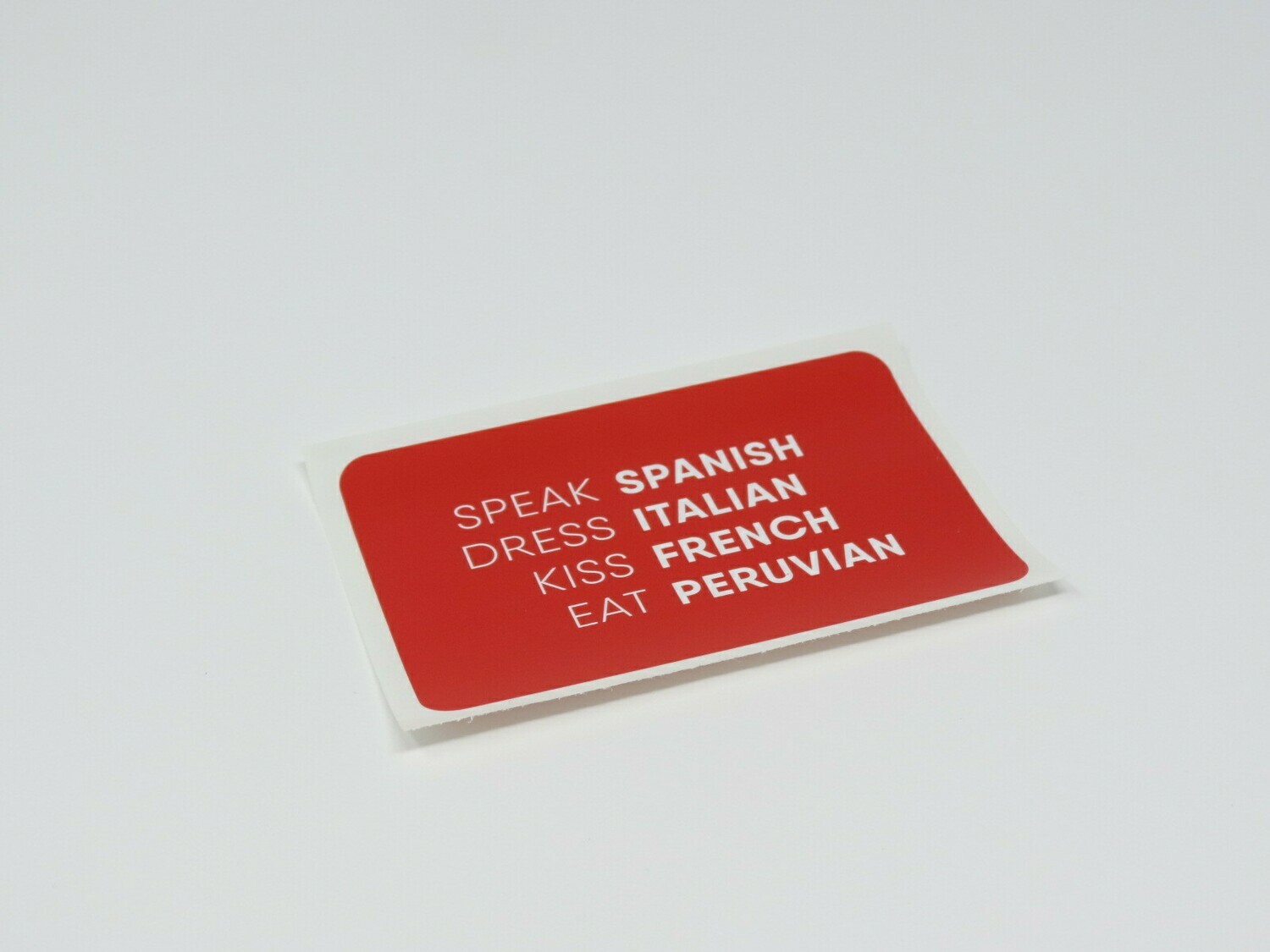 Speak Spanish, Dress Italian, Kiss French, Eat Peruvian Sticker