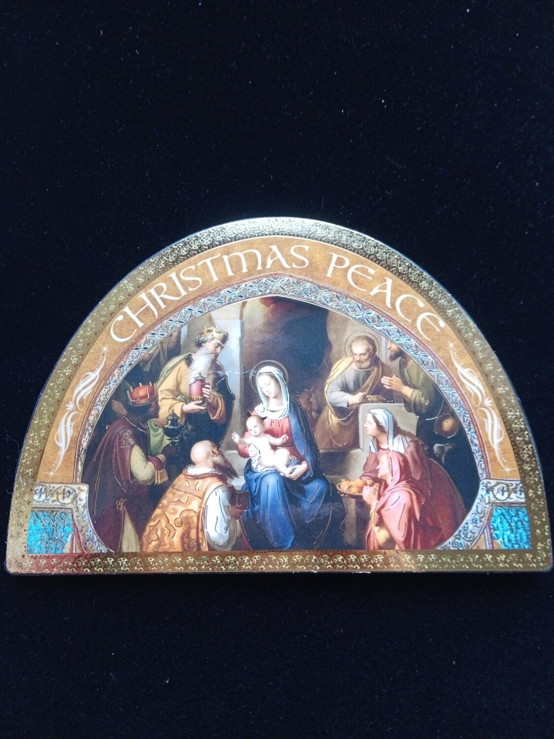 Nativity Plaque in Wood with golden highlights.