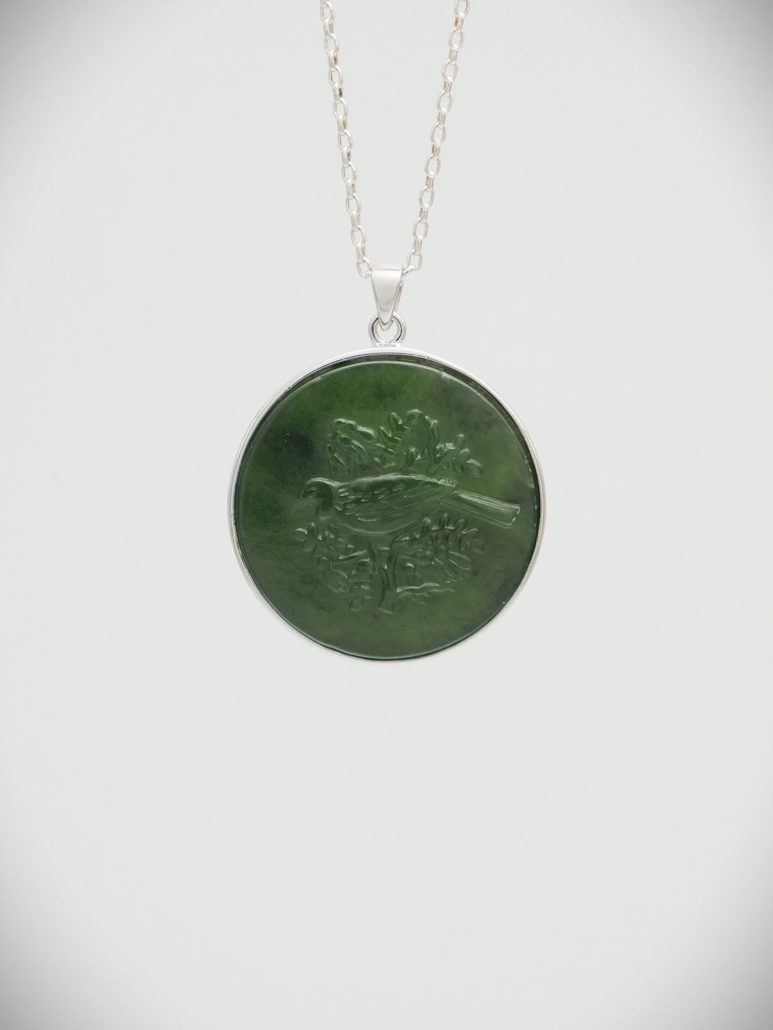 Moko Pounamu Greenstone and Sterling Silver Tui Pendant