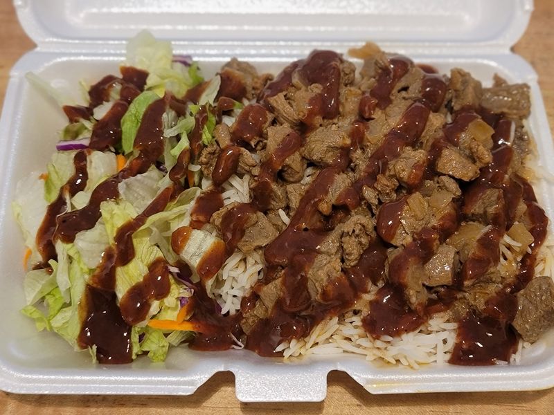 Nina's Desi Kitchen - Curry over rice