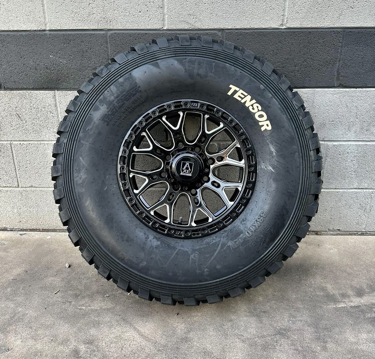 AXE 15X7 4x137 4x156 4+3 Wheels & 32x10-15 Tensor DS Tires (FREE Mounted)