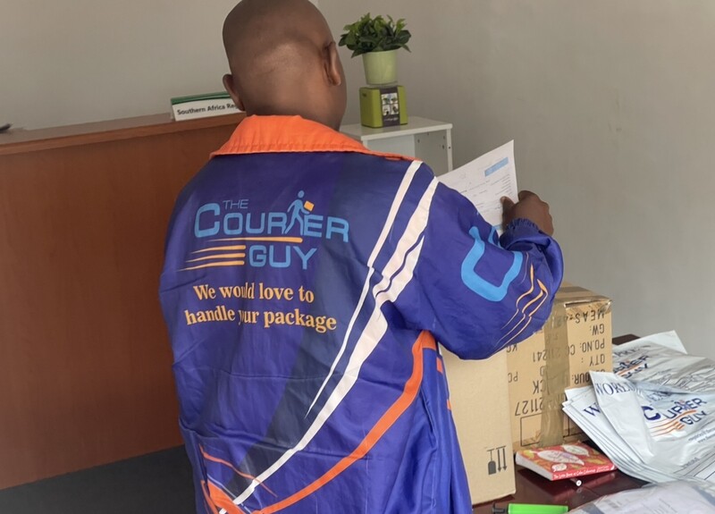 Courier Guy collecting parcels at David Jones Southern Africa Reception ...
