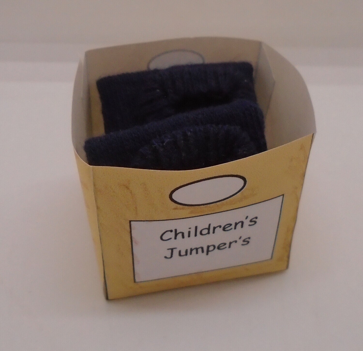 BOX WITH FOLDED JUMPERS