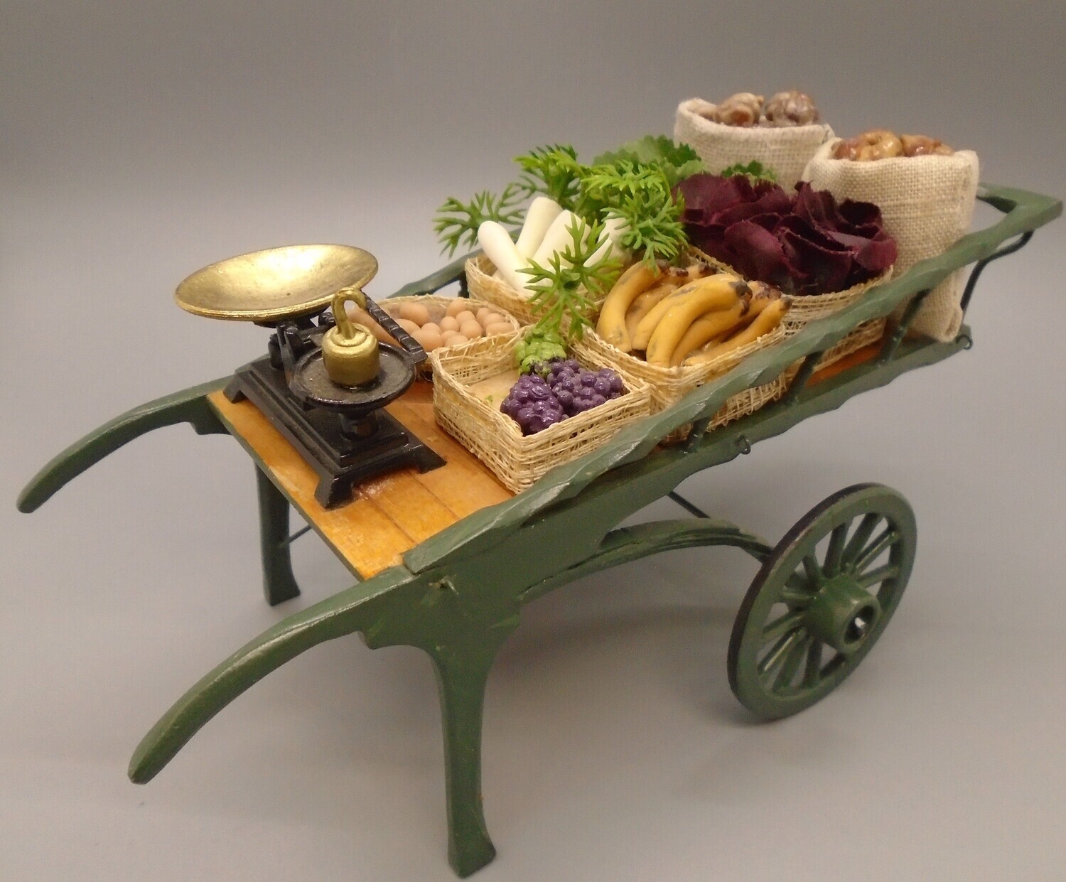 DRESSED MARKET BARROW WITH FOOD AND SCALES