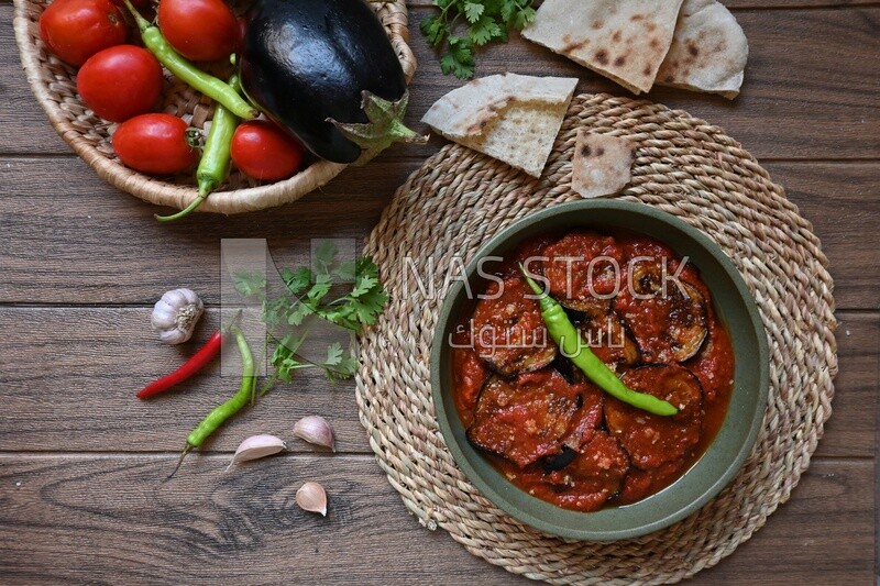 The ingredients of mesaka beside a plate of mesaka