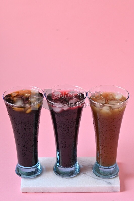Three cups of Arabian juice served in the holy month of Ramadan, carob ...