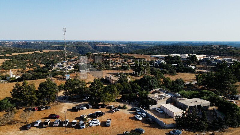 Drone footage shows an overview of buildings with trees in Libya, Libya ...
