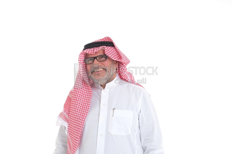 side view of a close-up of a Saudi man in traditional Saudi dress ...