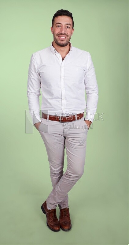 Photo of a handsome man standing and putting his hand in his pocket, a ...
