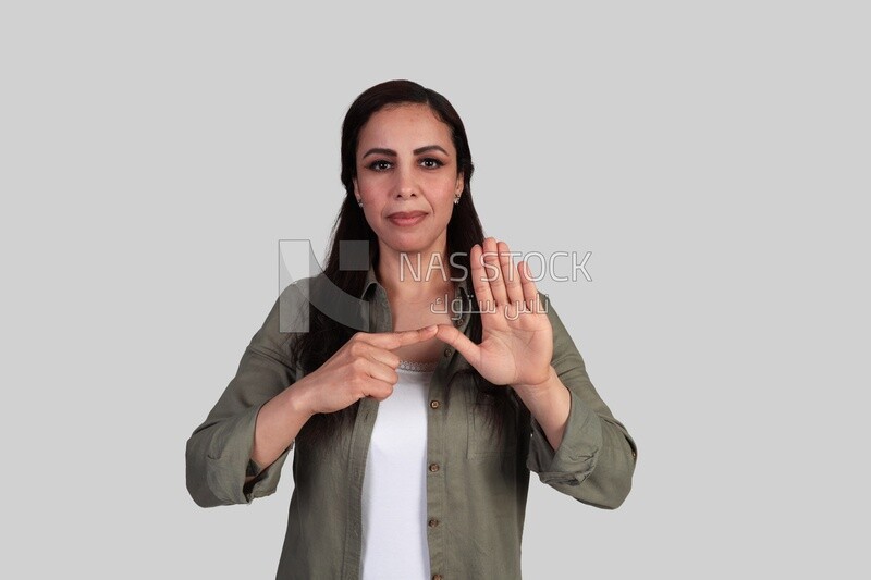 beautiful deaf young woman speaking in sign language