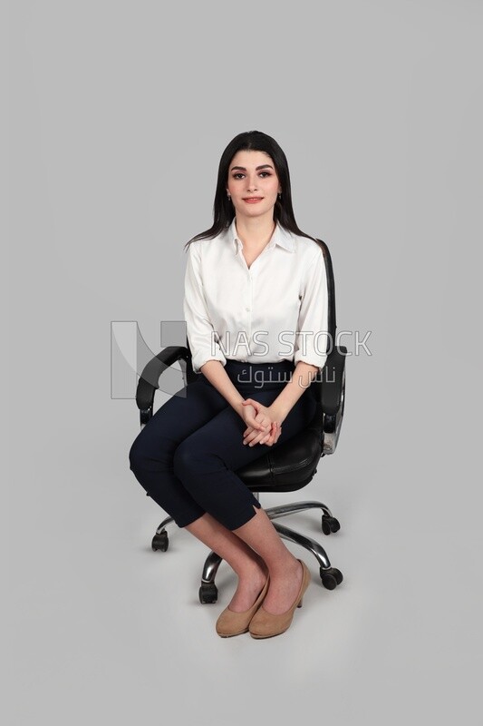 Photo of a businesswoman with formal wear sitting on a chair, business ...