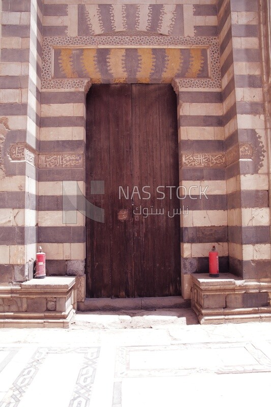 One of the doors of the Caliph mosques, worship and getting closer to ...