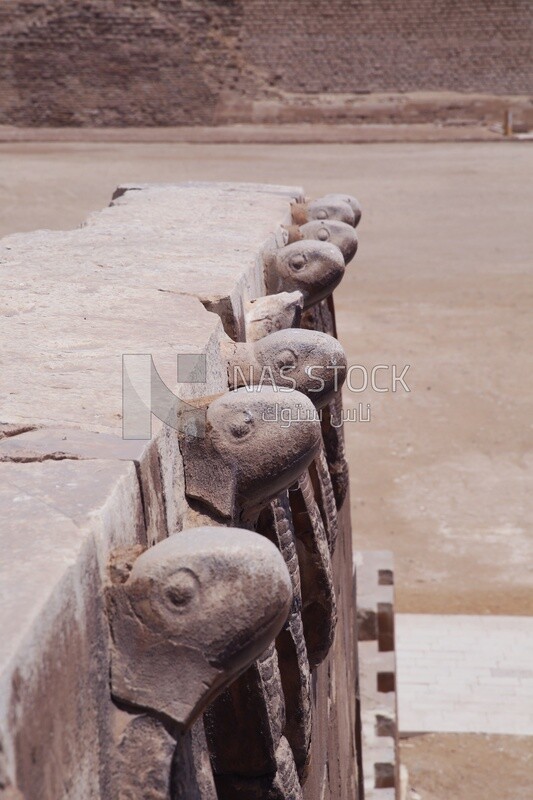 Cobra carved on top of a wall in the Pyramid Complex of Djoser, the ...