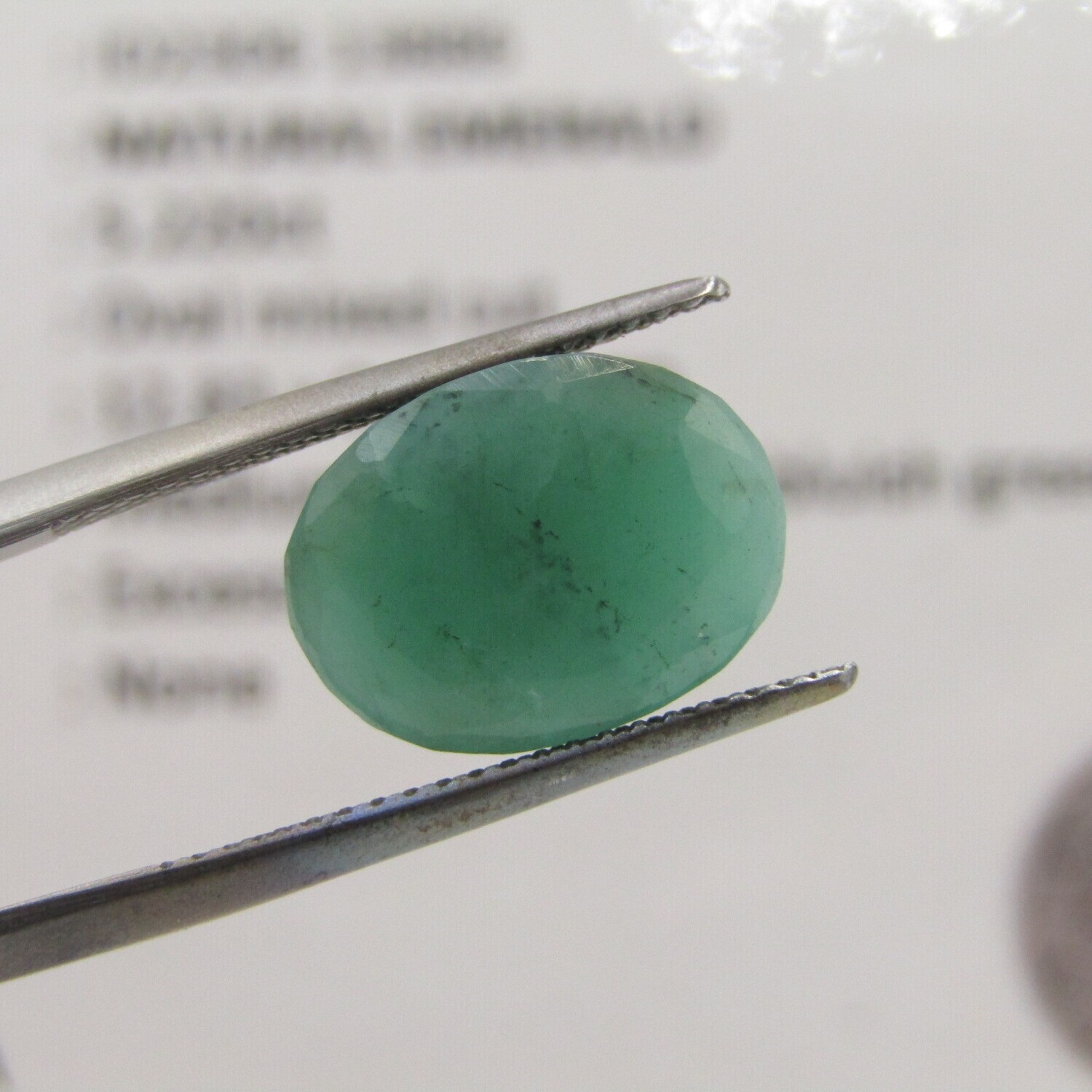 Natural Emerald of 5,22 carat oval mixed cut Medium toned slight bluish green with Gemlab ...