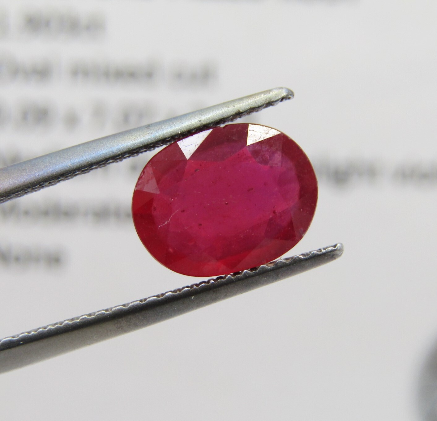 Fracture filled Ruby of 1,9 carat oval mixed cut slight violet red with ...