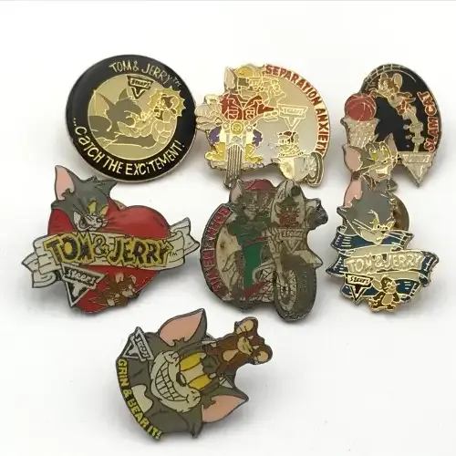 Lot of 7 Tom and Jerry pin badges issued by Steers