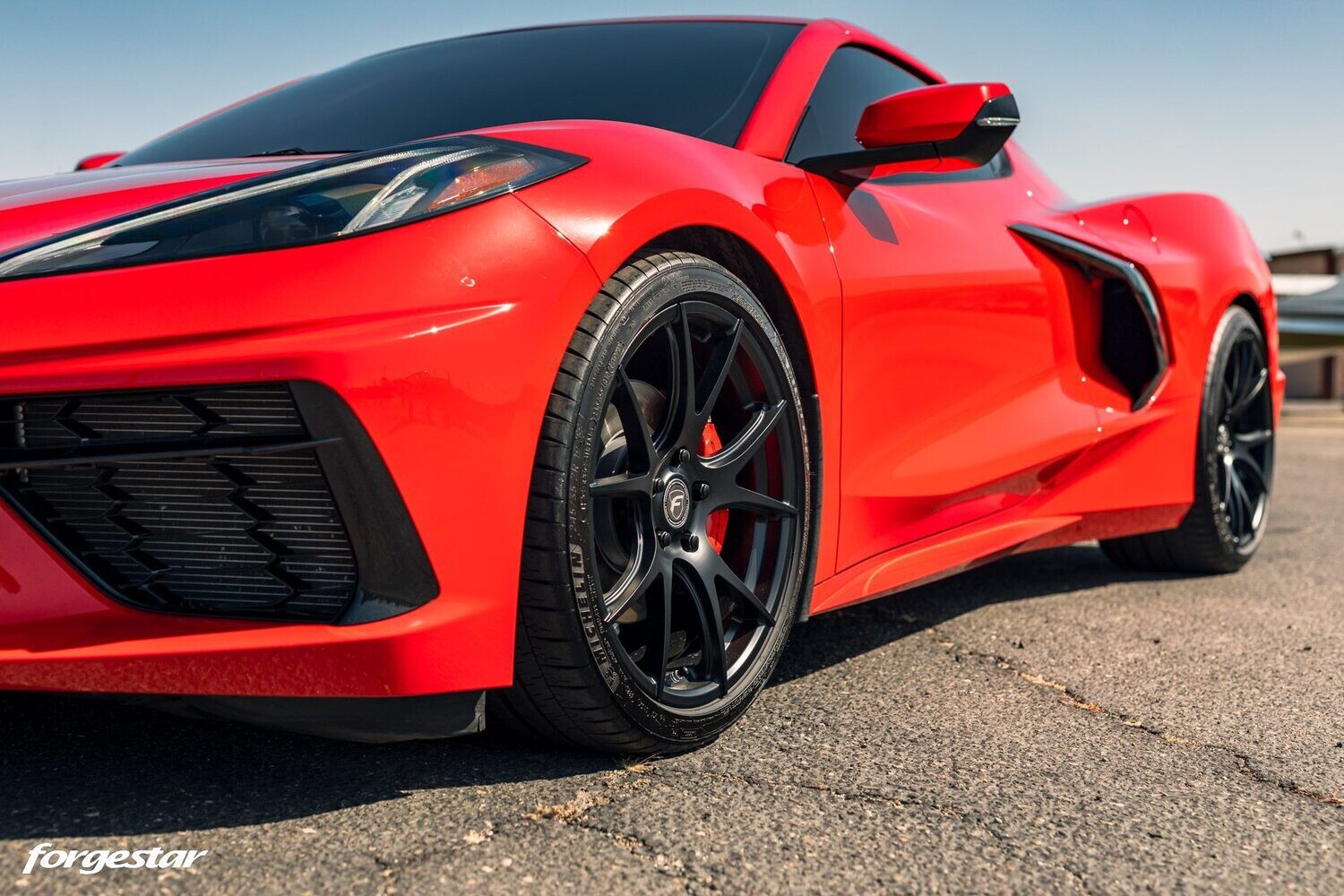 Torch Red C8 Corvette showcasing the lightweight Forgestar CF5V wheels