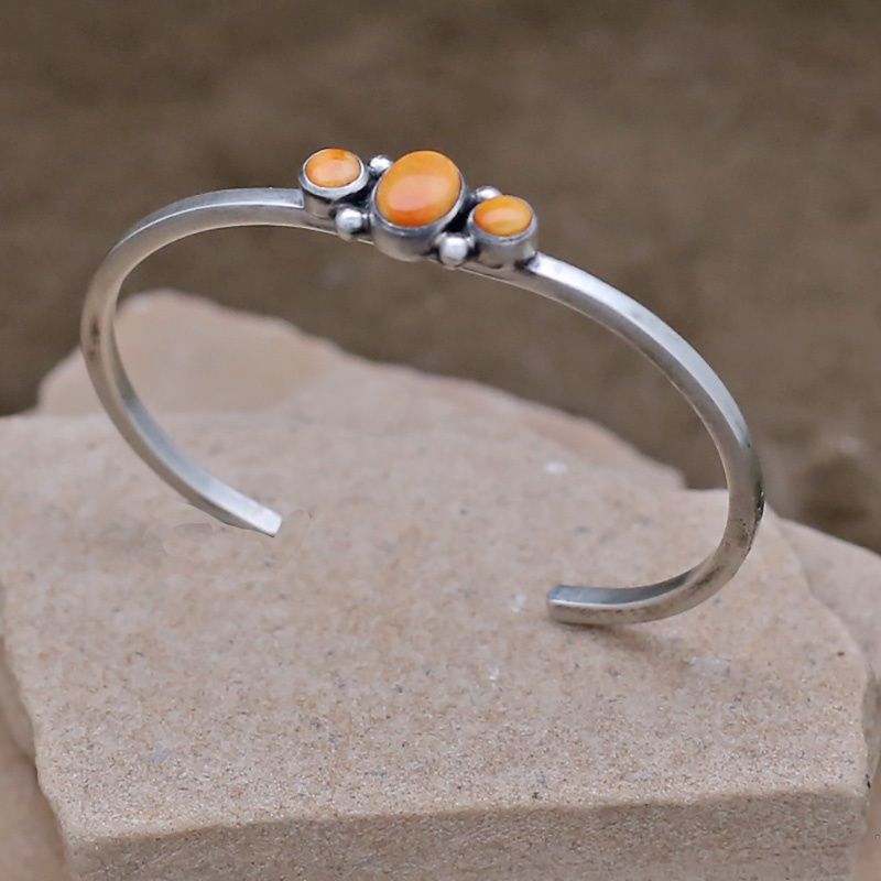 3-stone silver bracelet w/ orange spiny oyster shell