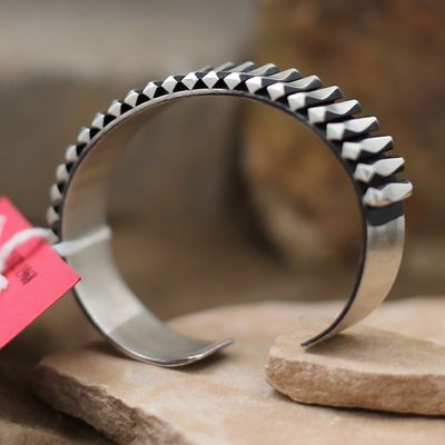 Large silver bracelet by Navajo artist Leander Tahe